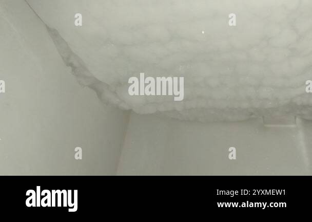 the process of melting the ice in the refrigerator freezer Stock Video ...