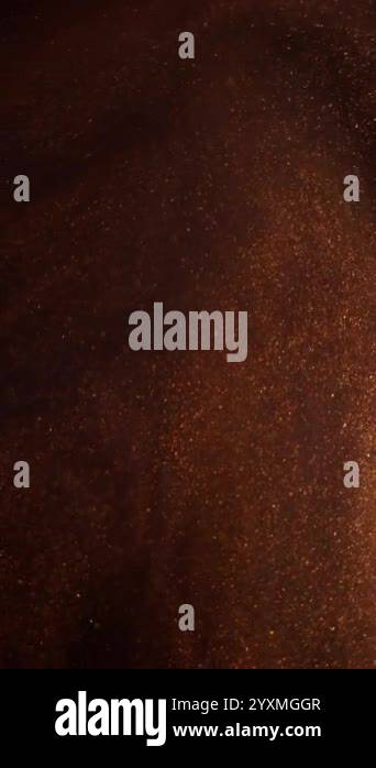 Vertical video. Glitter dust. Smoke splash. Ink water. Blur brown bronze golden color mist ...