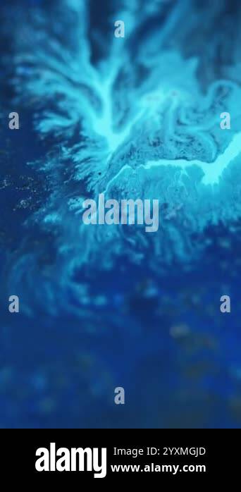 Vertical video. Acrylic paint splash. Sparkling fluid. Defocused blue ...