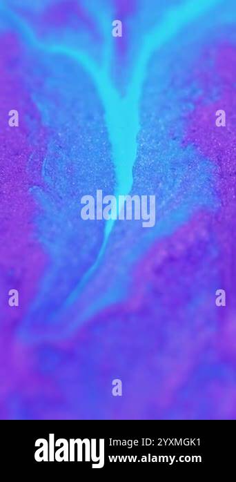 Vertical video. Ink spill. Liquid glitter texture. Defocused neon blue ...
