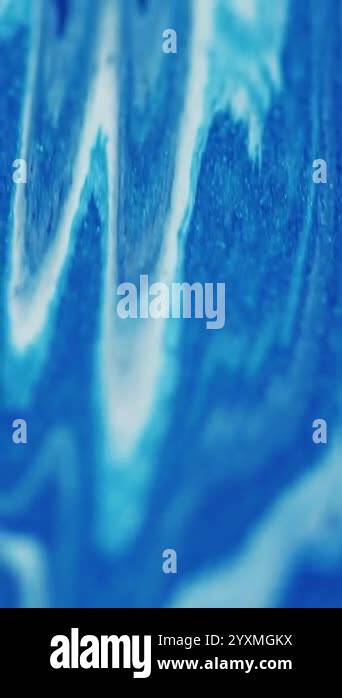 Vertical video. Glitter liquid drip. Marble texture. Defocused blue ...