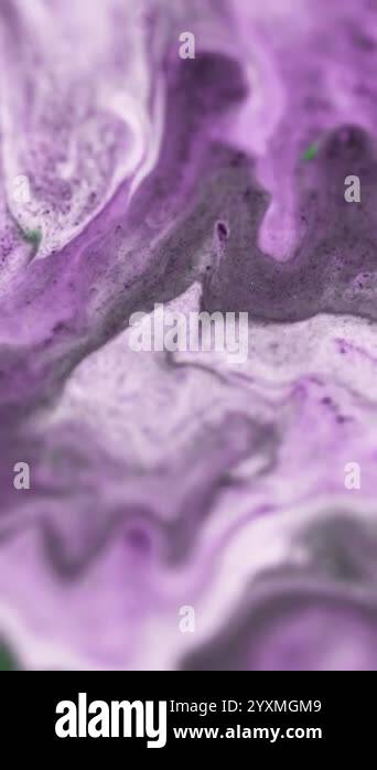 Vertical video. Acrylic fluid wave. Sparkling ink. Defocused purple ...