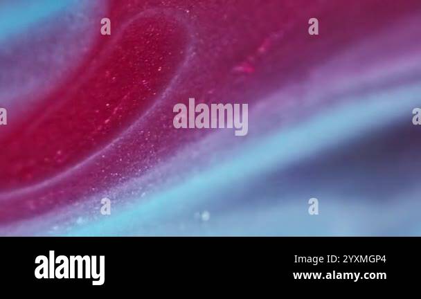 Sparkling particles. Bokeh light. Defocused shimmering red blue color sand texture ink wave ...