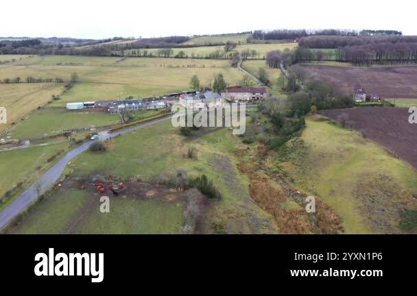 Aerial drone footage of large farmers field and rural houses in North ...