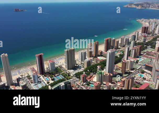 Aerial drone footage of the beautiful city of Benidorm in Spain in the ...