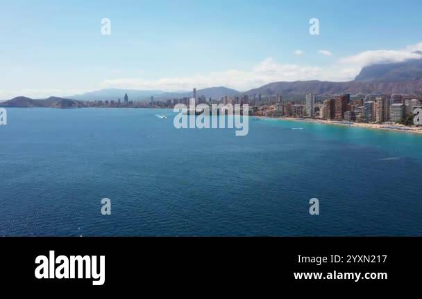 Aerial drone footage of the beautiful city of Benidorm in Spain in the ...
