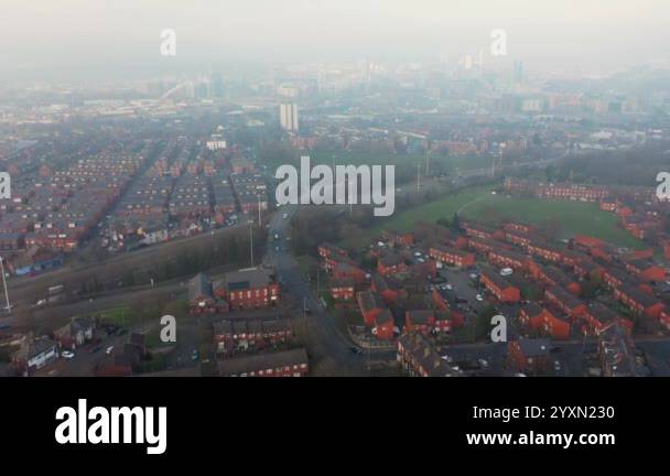 Foggy rainy aerial drone footage of the town centre of Leeds, West ...
