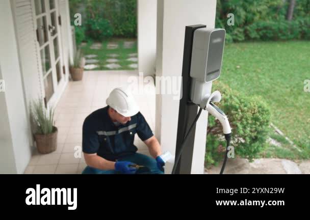 Qualified technician install home EV charging station, providing maintenance service for ...