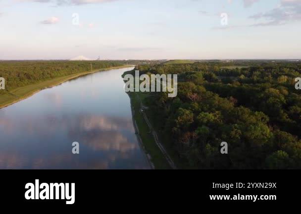 A horizontal drone shot flying over a river with a beautiful view of a ...