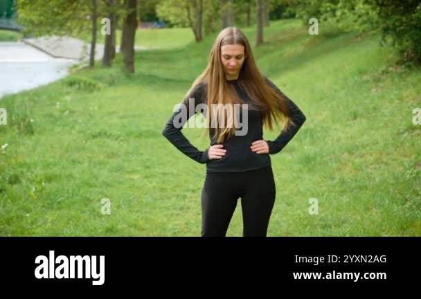 Young woman dancing, rotating hips outdoors. Female twirling waist ...