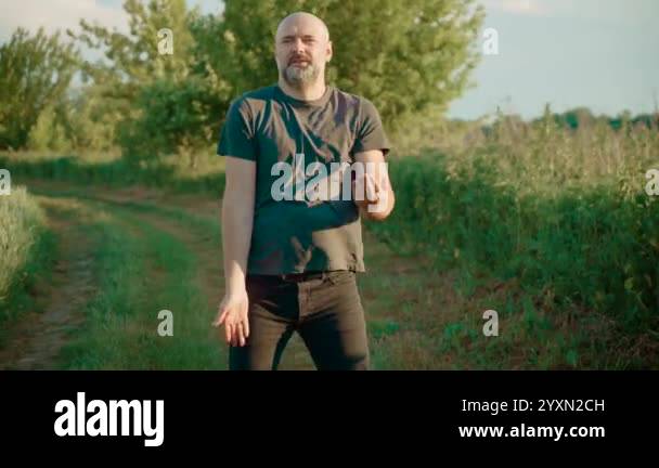 Bald male dancing joyfully with lively gestures and cheerful energy ...