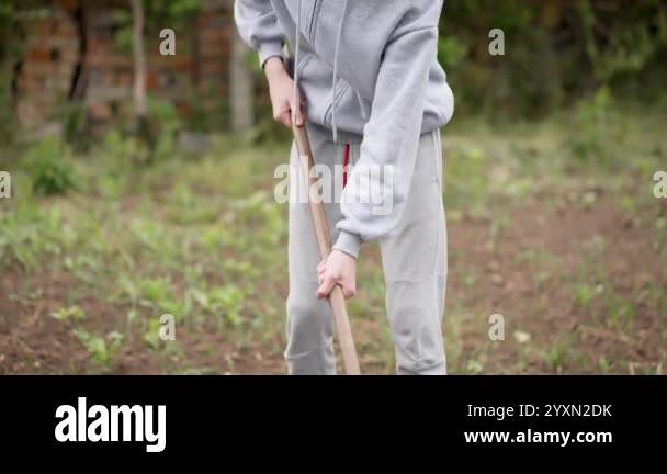 Farmer man working in garden using gardening tools. Male farmer tending ...