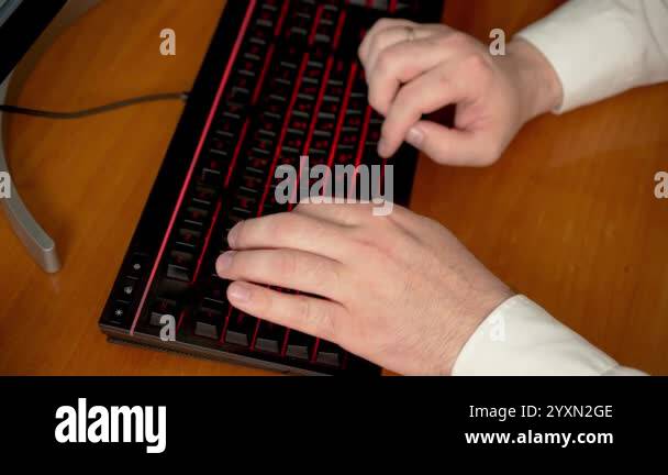 Close up man hands typing on keyboard pressing keys. Male hands quickly ...