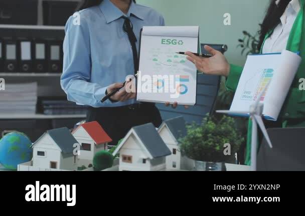 real estate agent showing house model of house model to buy real estate ...