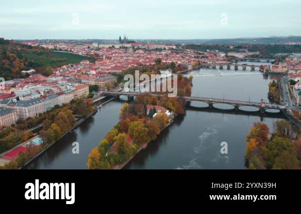 Aerial view of cityscape of Prague with colorful autumn trees on island ...