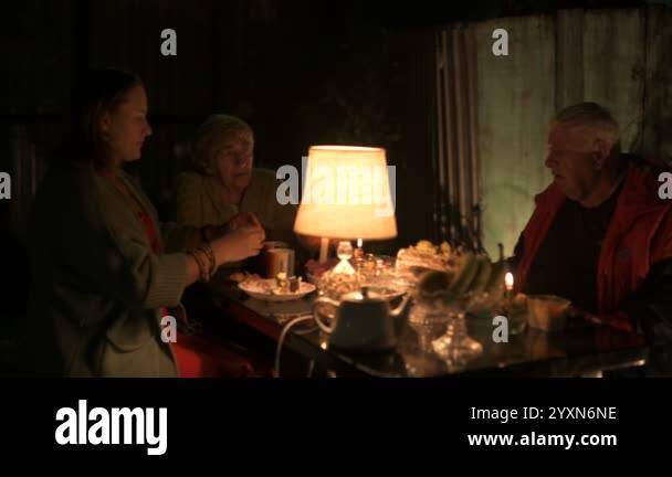Happy elderly couple and their adult daughter celebrate holiday in the ...