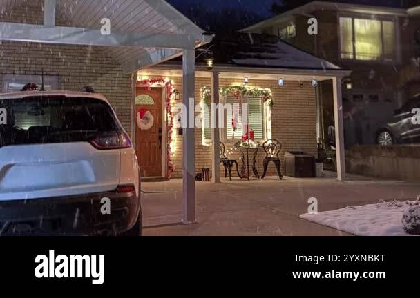 A slow nighttime zoom establishing shot of a typical New England style ...