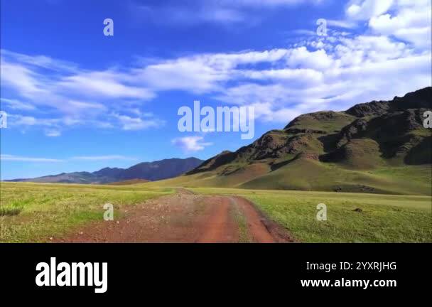 Lush green fields and rugged hills beneath a vibrant blue sky the way ...
