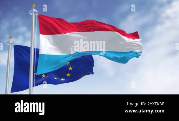 Flags of Luxembourg and the European Union waving in the wind on a clear day. Seamless 3d render ...