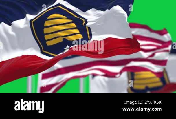 The Beehive Flag of Utah and the american flag waving isolated on green ...