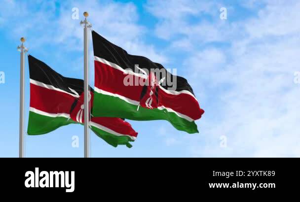 National flags of Kenya waving on a clear day. Black, red, and green ...