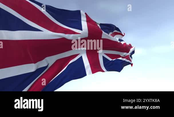 Close-up of national flag of the United Kingdom waving in the wind ...