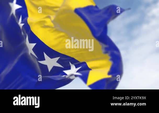 Close-up of Bosnia and Herzegovina national flag waving in the wind ...