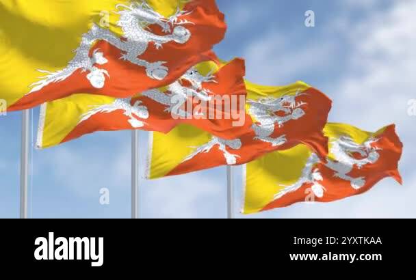 Close-up of Bhutan national flags waving in the wind. Yellow upper ...