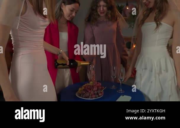 Pre-wedding girlfriends party. Group of young women friends and bride ...