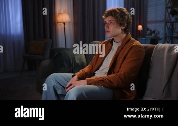 Man spending free time at home. Young man spending evening at home ...