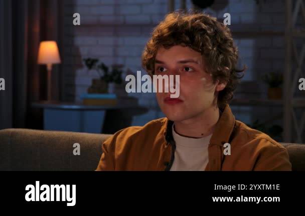 Man spending free time at home. Young man spending evening at home ...