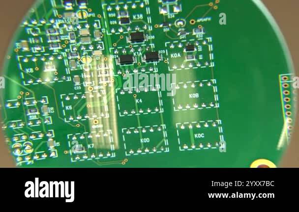 Circuit board controlled under microscope magnifying glass ...