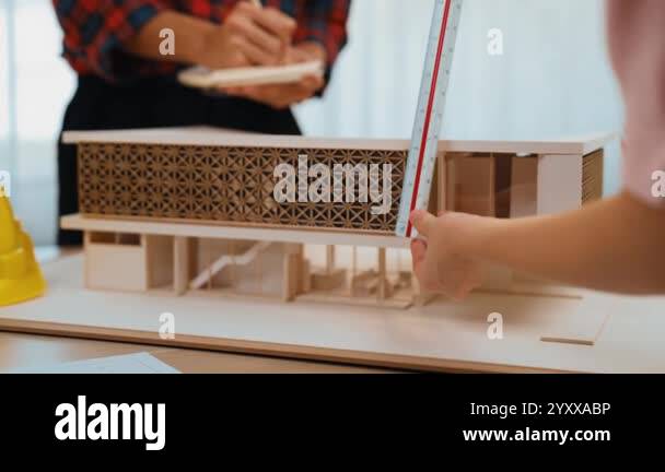 Slow motion home designer using architectural equipment review and ...