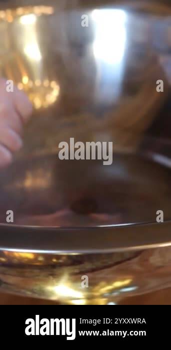 The priest blesses the water on the baptismal font in the church. The Sacrament of Baptism in ...
