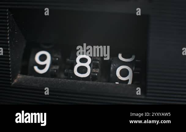 Close-up shot of a digital counter transitioning from 987 to 000. Ideal ...