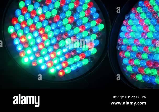 A top view of a vibrant LED panel displaying a grid of blue, green, and ...