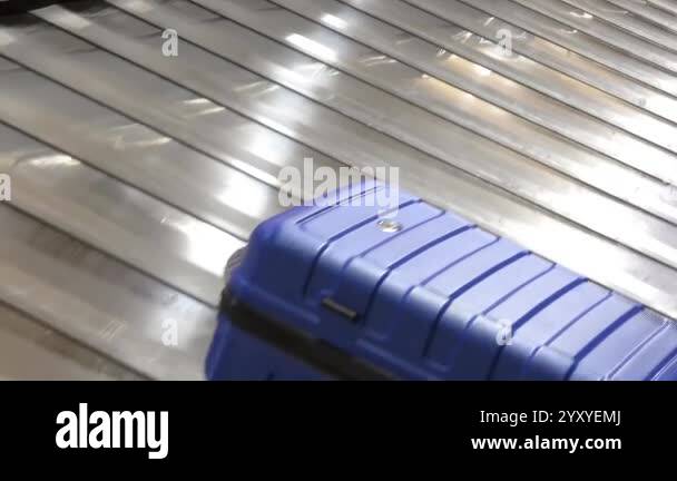 Calgary, Alberta, Canada. Nov 24, 2024. Luggage glides along the ...