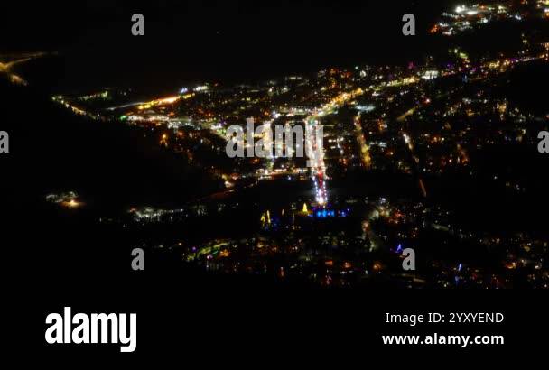 Banff, AB, Canada. Dec 9, 2024. Aerial night view of the Town of Banff ...