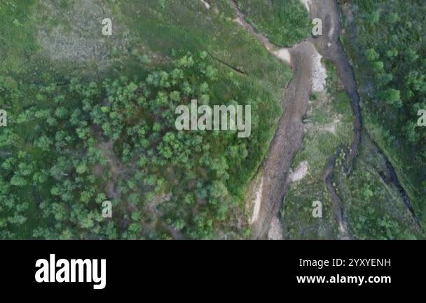 Following a meandering wilderness river with birds-eye view in Lapland ...
