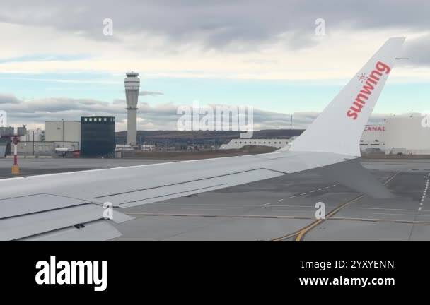Calgary, Alberta, Canada. Dec 5, 2024. A Sunwing Airlines plane ...