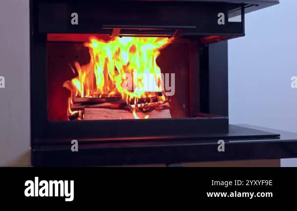 Bright flames dancing in modern fireplace, emitting warmth and creating ...