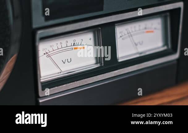 A close-up view of the VU meters on an old-school boombox. This shot ...