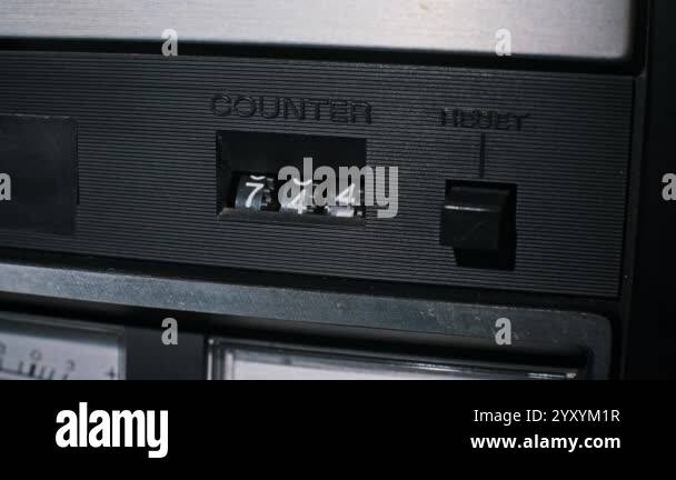 Detailed view of a vintage tape counters rotating numbers. The ...