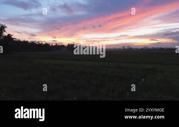 Drone view of sunset and golden hour in the countryside with a background of golden clouds in ...