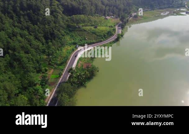 Drone view of the highway on the banks of the Serayu River, Banyumas ...