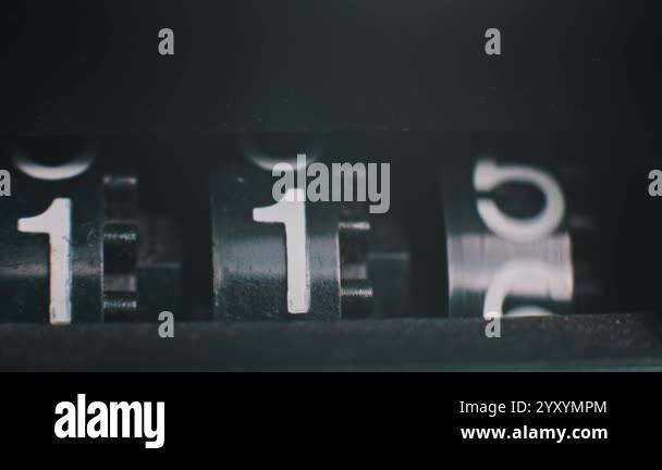 Detailed view of an old mechanical number counter, showing the digits ...