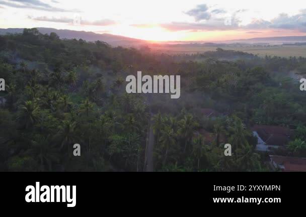 Drone view of sunset and golden hour in the countryside with a background of golden clouds in ...