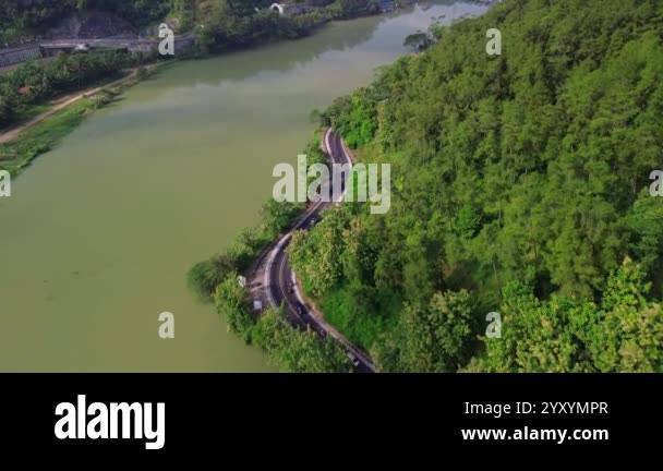 Drone view of the highway on the banks of the Serayu River, Banyumas ...