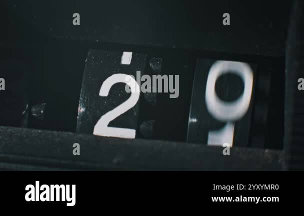 Close up shot of a vintage mechanical counter with numbers rolling ...