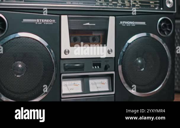 A slightly wider shot of a vintage stereo system with a cassette tape ...